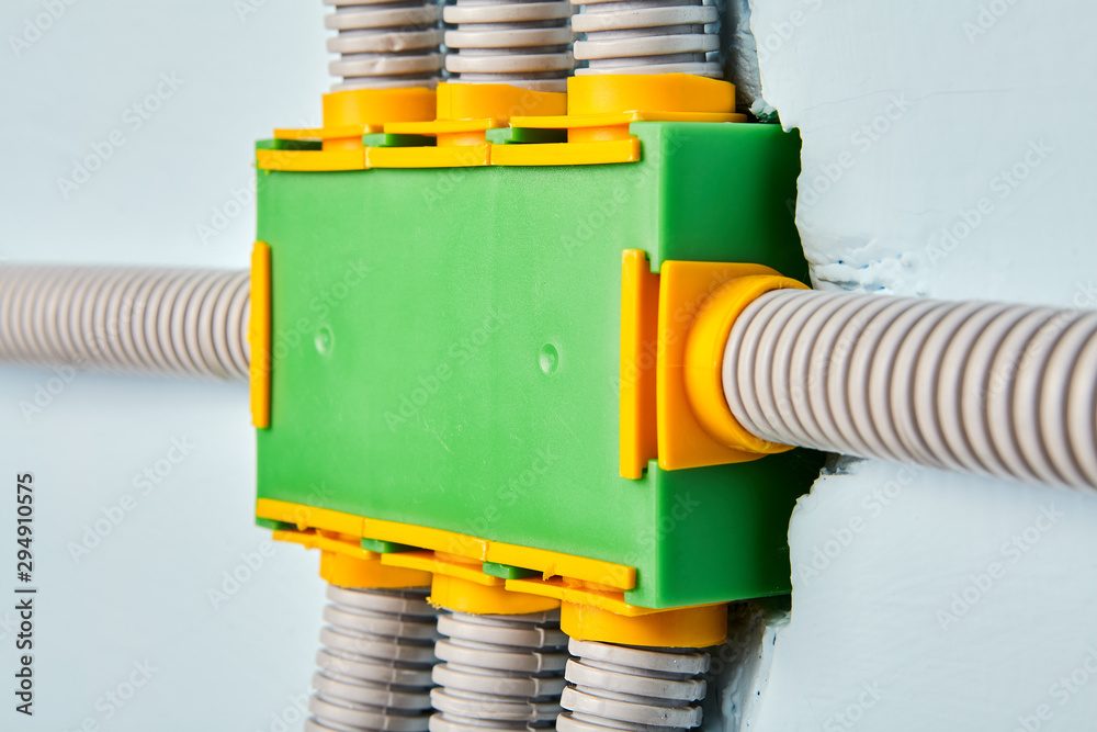 Flexible PVC conduit is connected to junction box. Stock Photo | Adobe ...