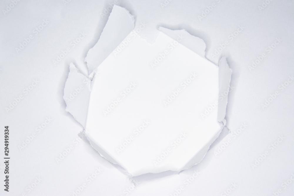 Ripped hole in the paper with torn edges Stock Photo | Adobe Stock