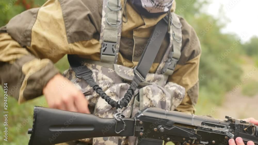 Laser tag game. The game of airsoft. Soldier check weapons. Men play ...