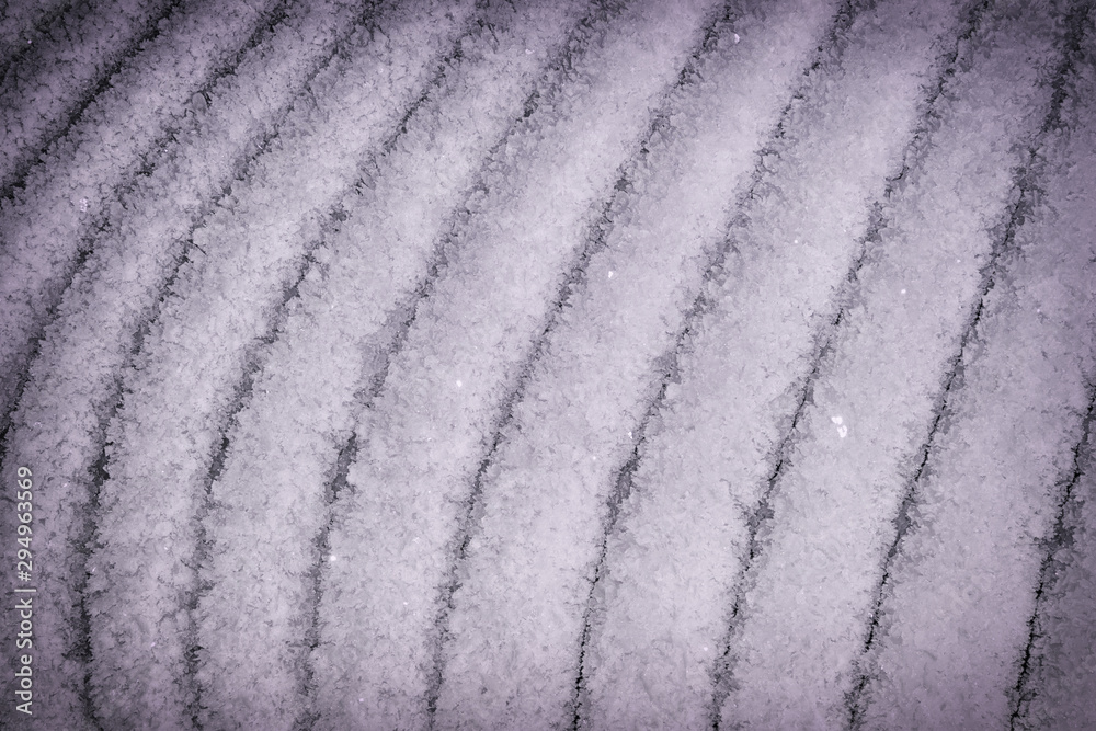 Unusual ice patterns, curved lines. Violet tinted photo with vignette ...