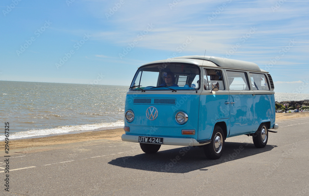 Classic Blue and white camper van being driven along Felixstowe ...