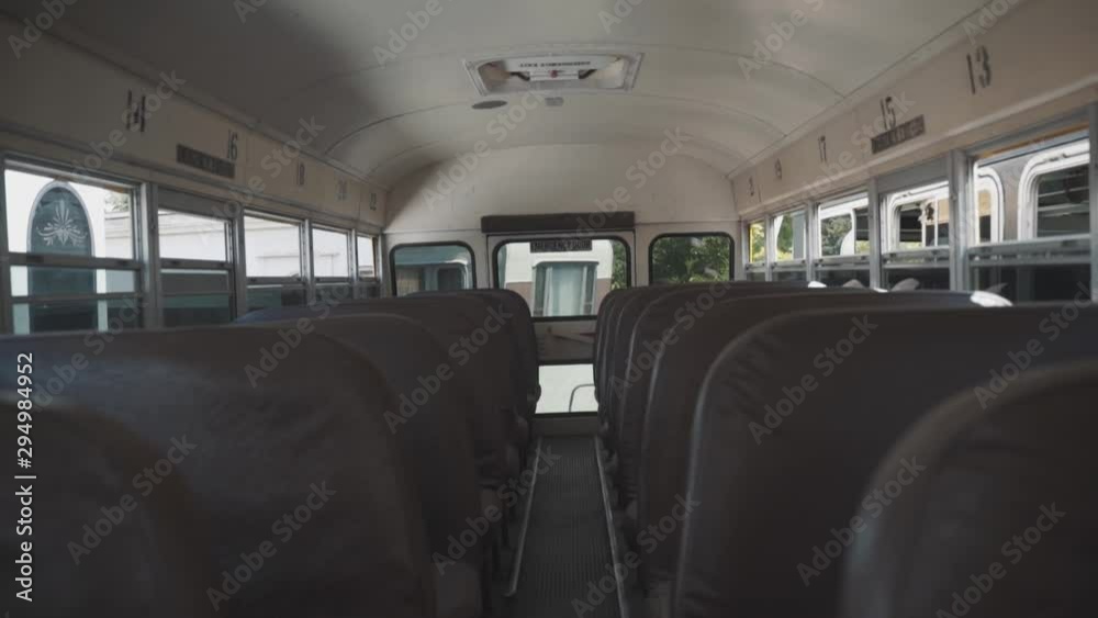 Empty school bus aisle during daytime Stock Video | Adobe Stock
