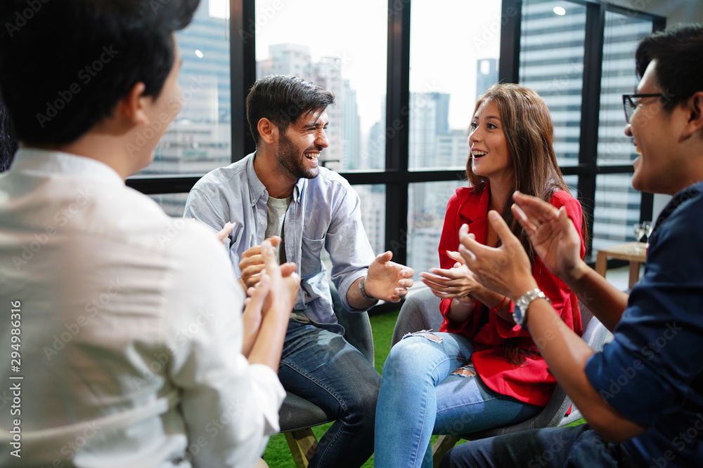 Group of young business hand clapping in the office after business work ...