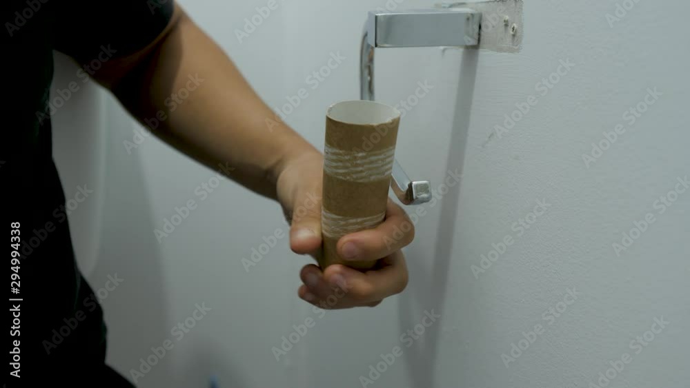 there is no toilet paper. guy realise that there is no toilet paper ...