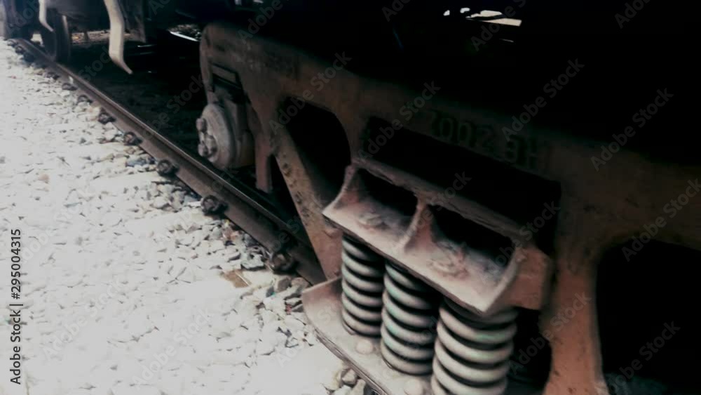 Low angle motion shot showing the extreme lower parts of a train and ...