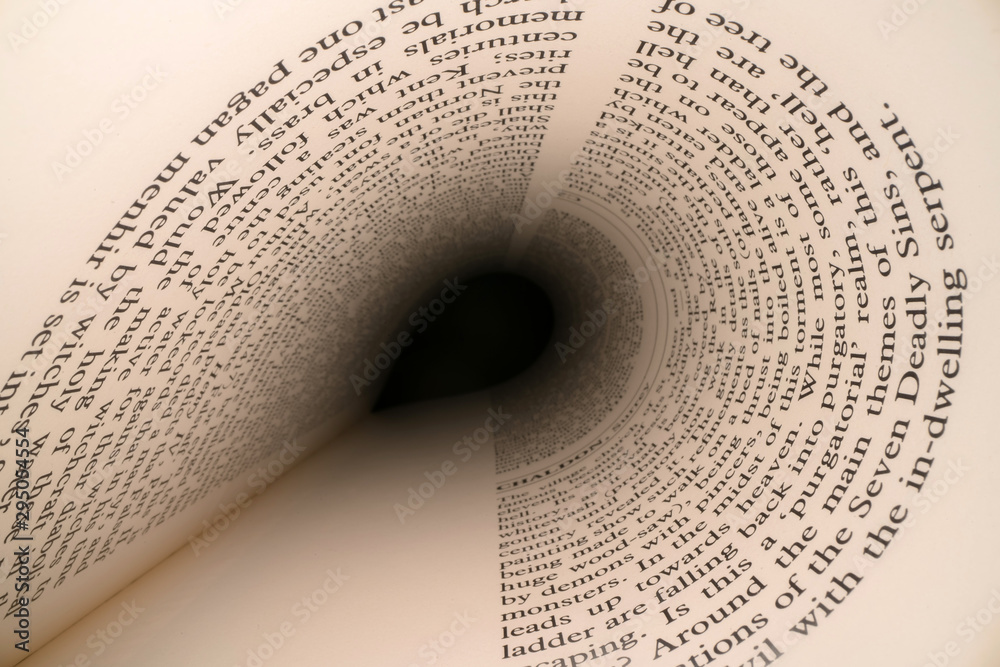 Inside the book concept. Latin letters and words on an tunnel shaped ...