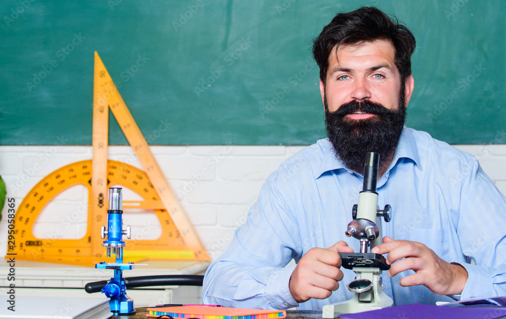 Fascinating research. Set up microscope. Teacher sit desk with ...