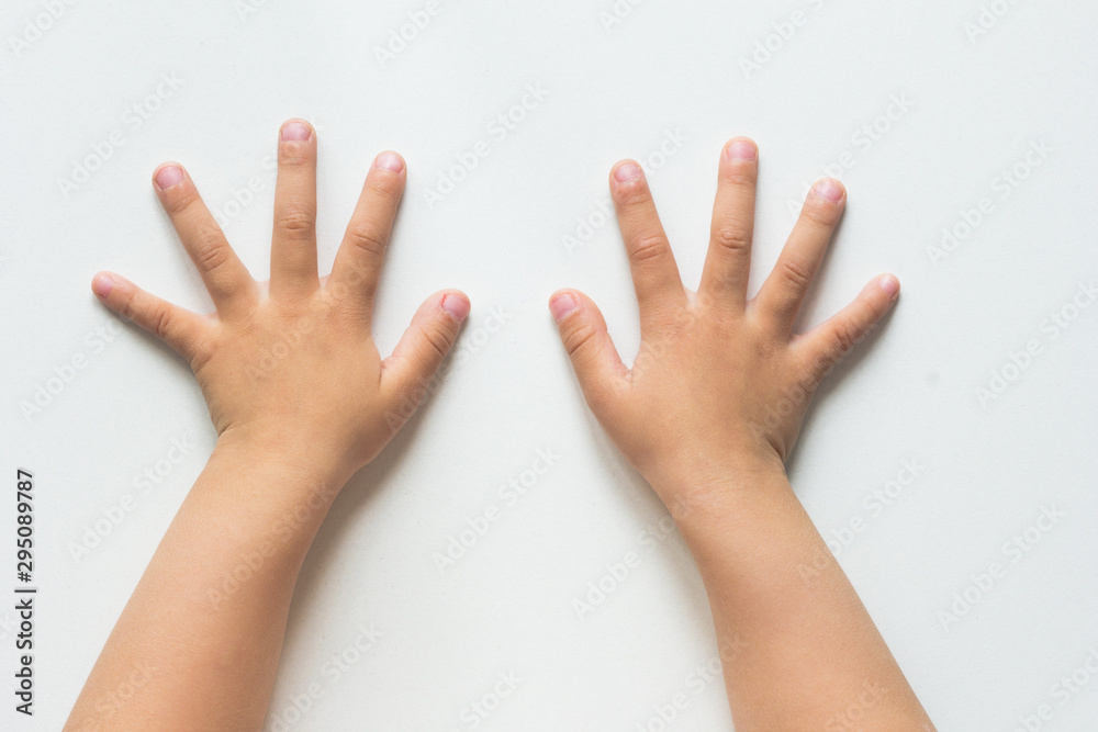 Two hands of child with widespread fingers on the white background ...
