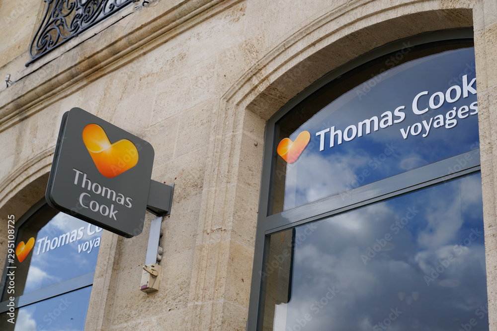 store front of Thomas Cook logo sign office closed British global ...