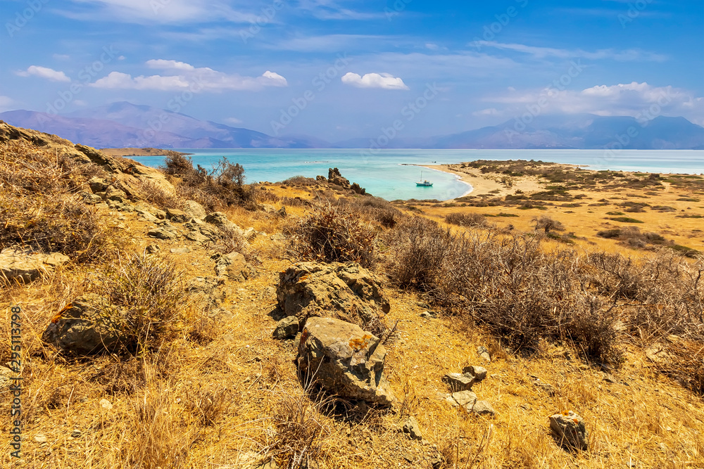 picturesque rocks in savannah with beautiful golden gtass on a coast ...