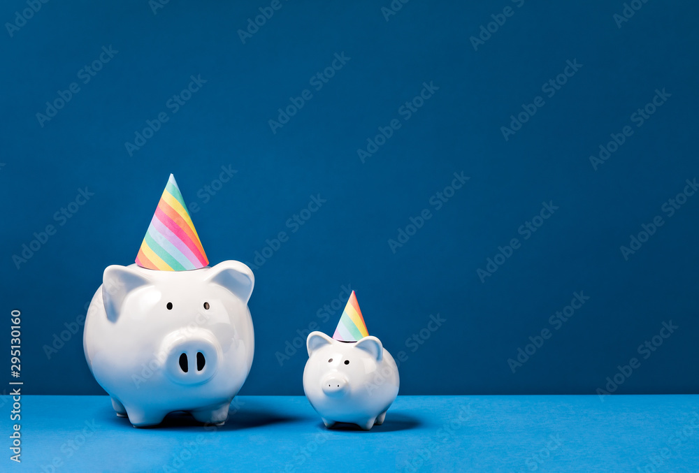 Piggy Banks wearing Birthday Party Hats Stock Photo | Adobe Stock
