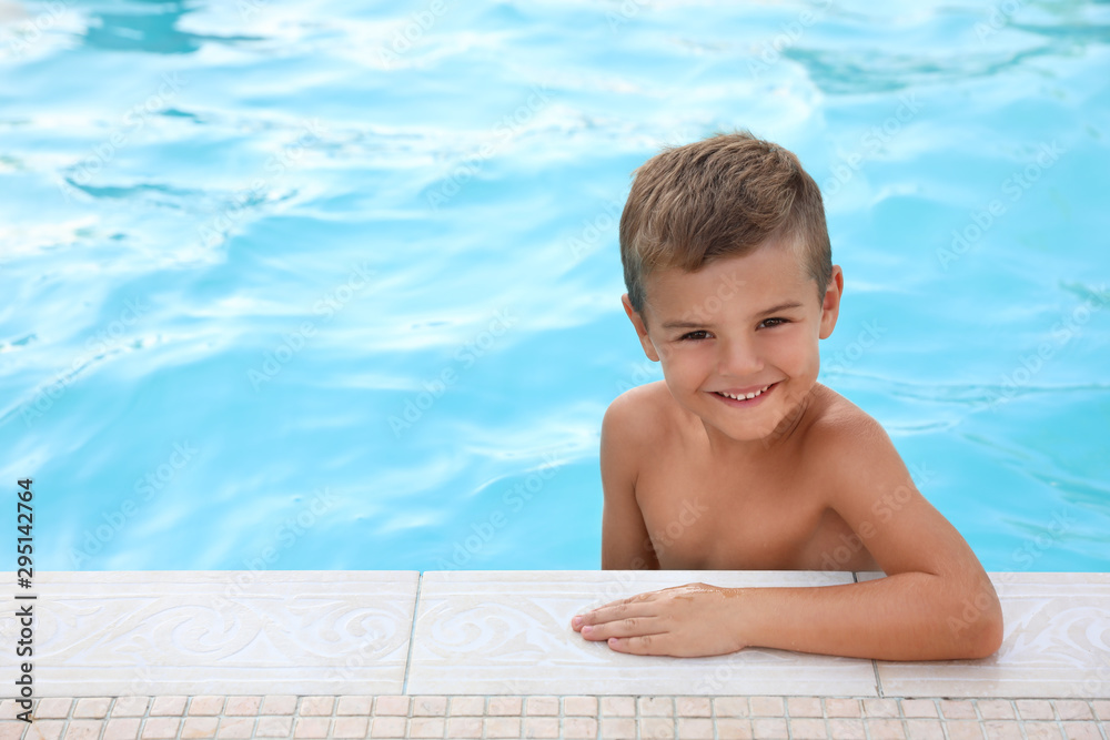 Cute little boy in outdoor swimming pool Stock Photo | Adobe Stock