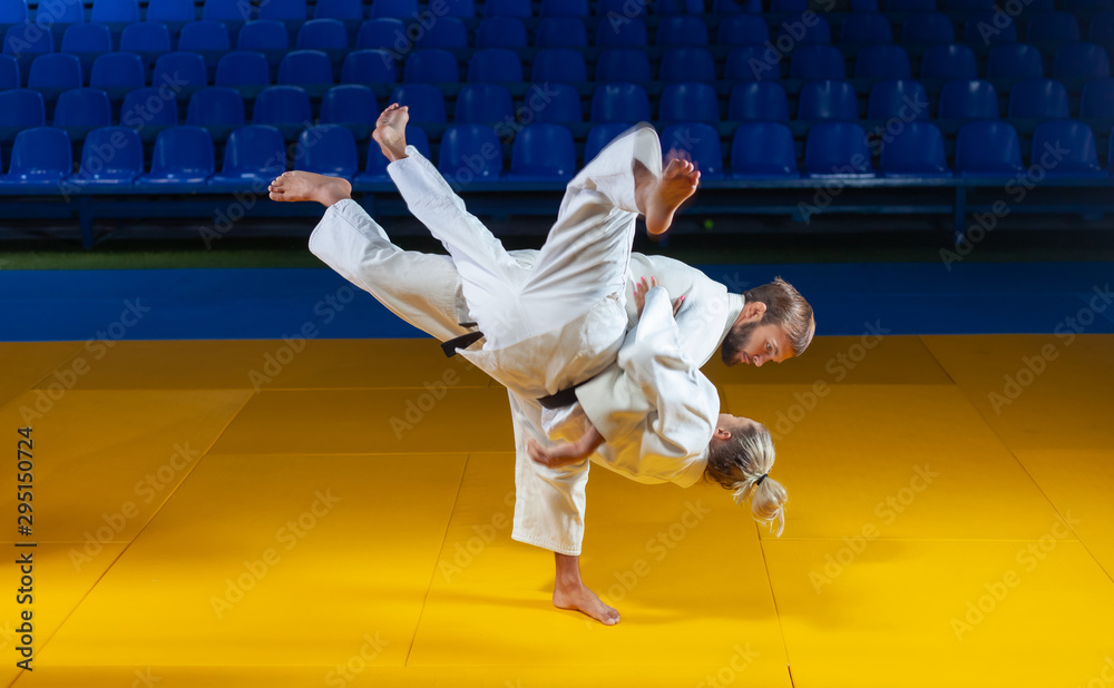 Martial arts. Sparing Portners. Sport man and woman in white kimono ...