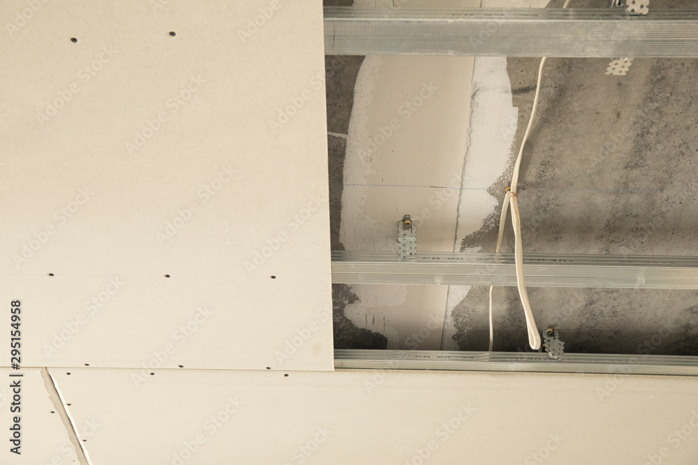 Installation the ceiling profile in the new flat Stock Photo | Adobe Stock