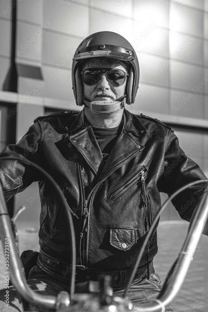 Black and white Portrait of a middle-aged man, an old biker in a ...