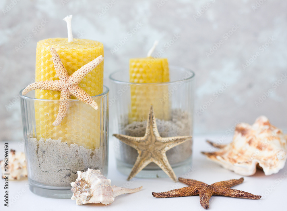 wax candles in jars with sea sand, sea shells. Marine style home ...