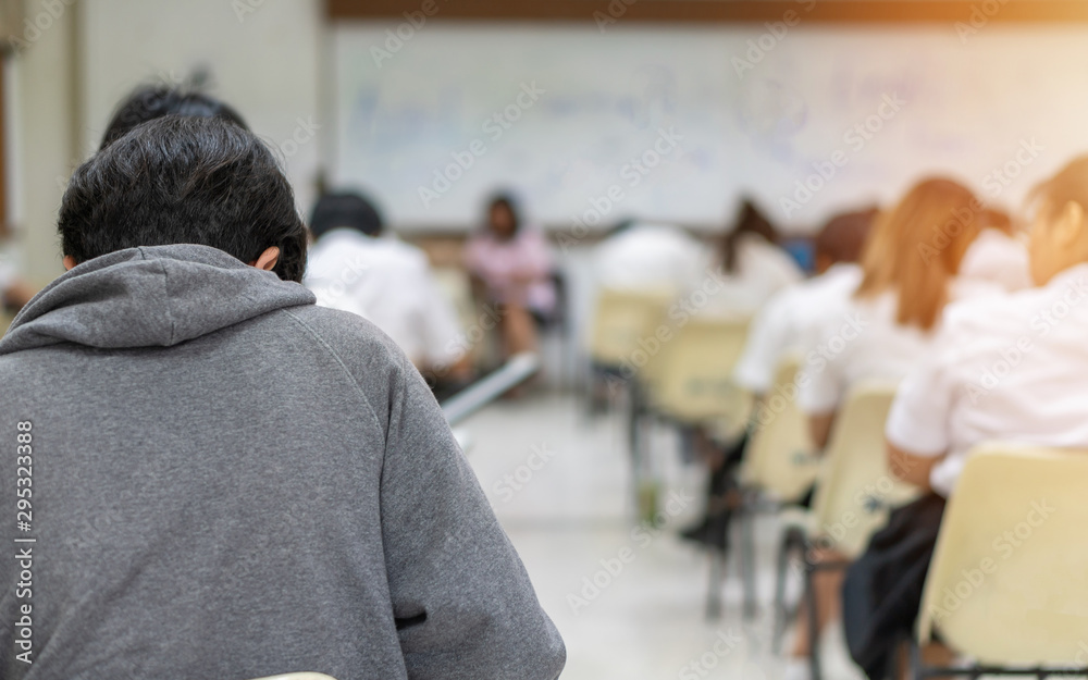Exam with school students in class back view of the classroom of young ...