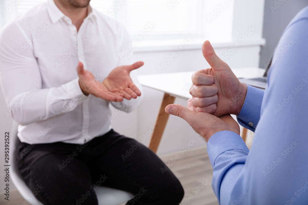 Smiling Deaf Man Learning Sign Language Stock Photo | Adobe Stock
