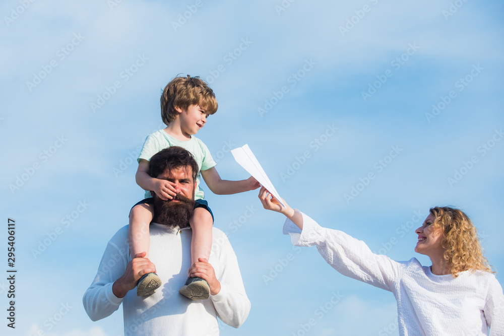 Child sits on the shoulders of his father. Retro hipster romantic ...