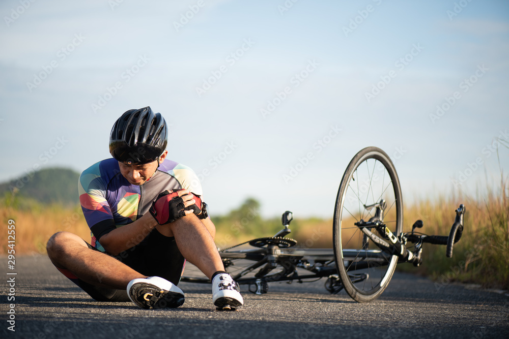 Bike injuries. Man cyclist fell fell off road bike while cycling ...