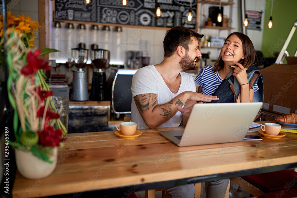 Smiling owner in coffee shop. Small business owner..man and woman ...