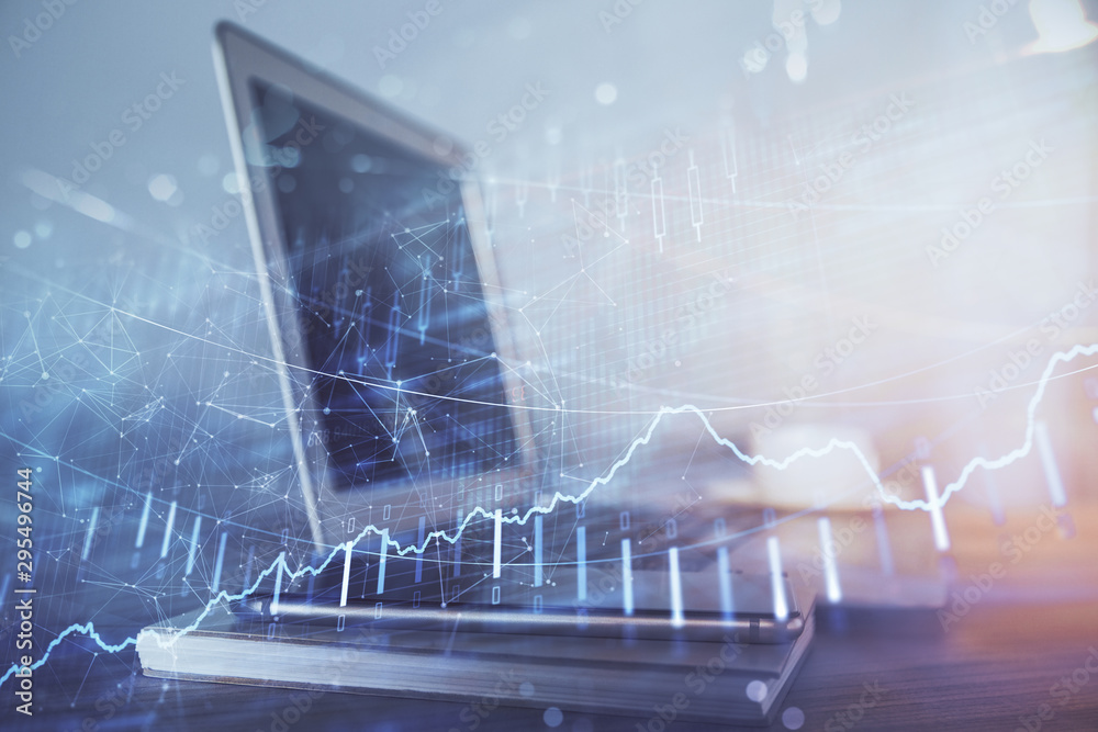 Stock market graph on background with desk and personal computer. Multi ...