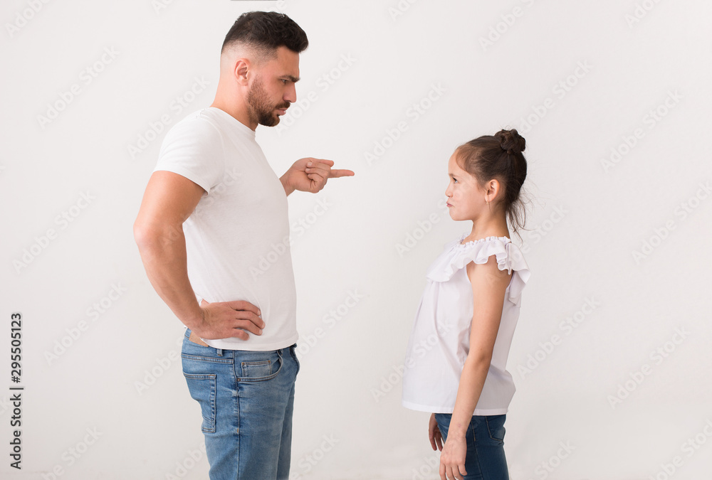 Angry father pointing his daughter and giving lesson to her Stock Photo ...