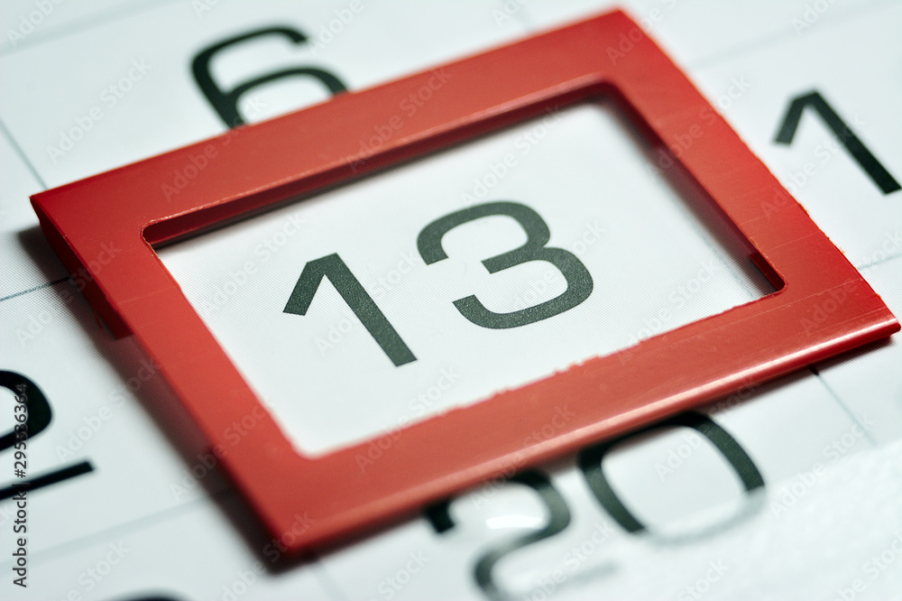 the thirteenth day of the month highlighted on the calendar with a red ...
