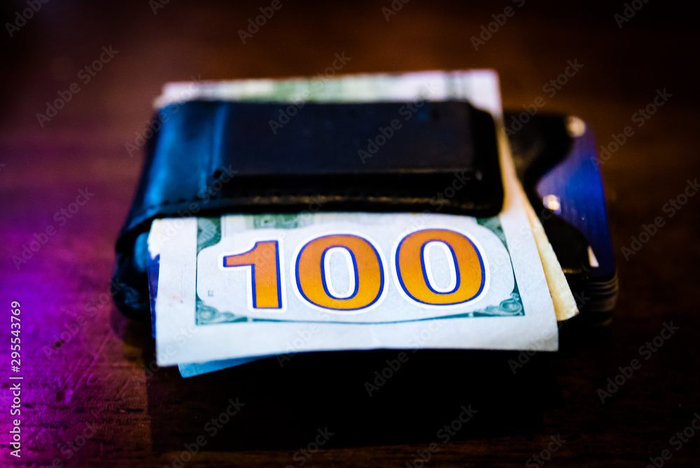 100 dollar bill c-note in black leather money holder Stock Photo ...