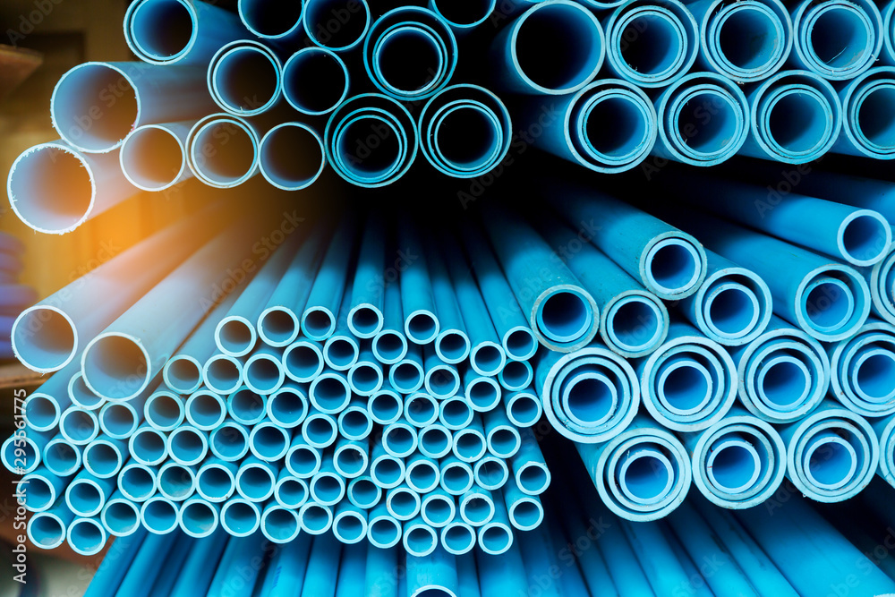 Close up to blue plastic pipe background, PVC pipes stacked in ...