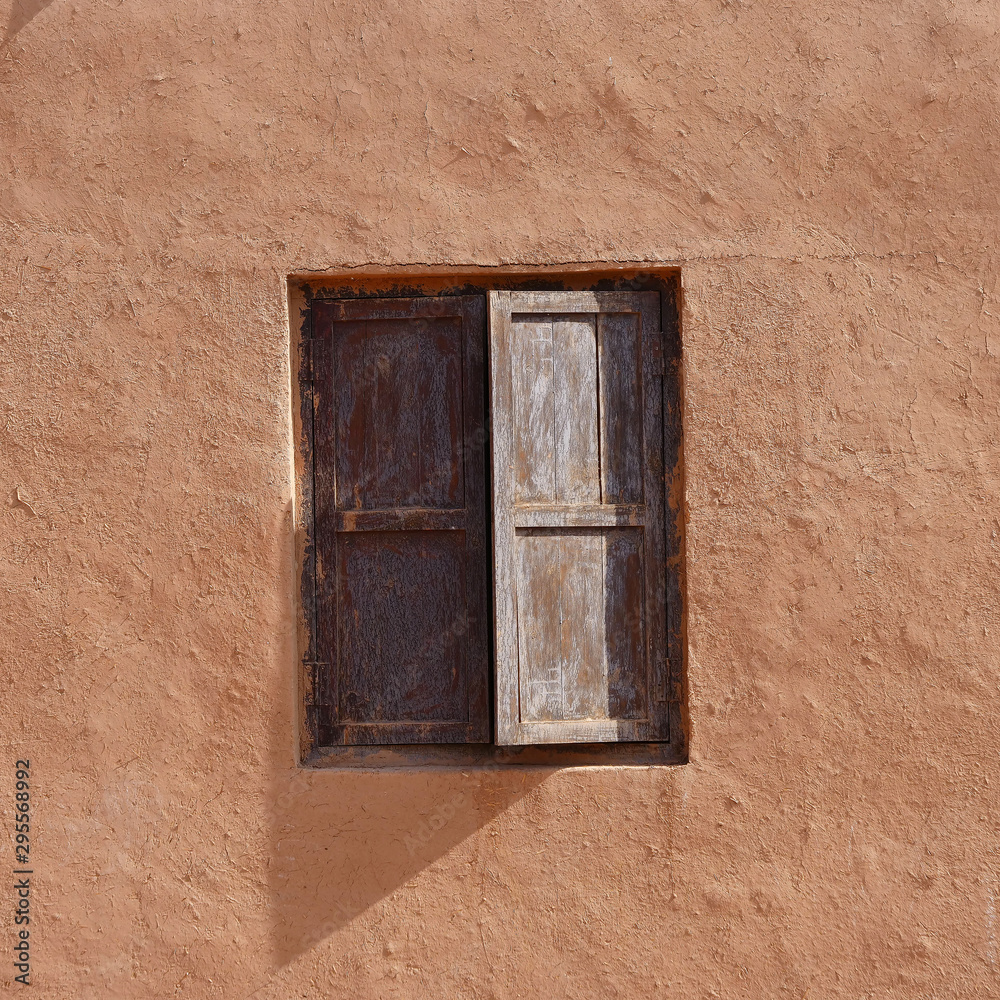 Ancient traditional residential old house wall and wooden window in ...