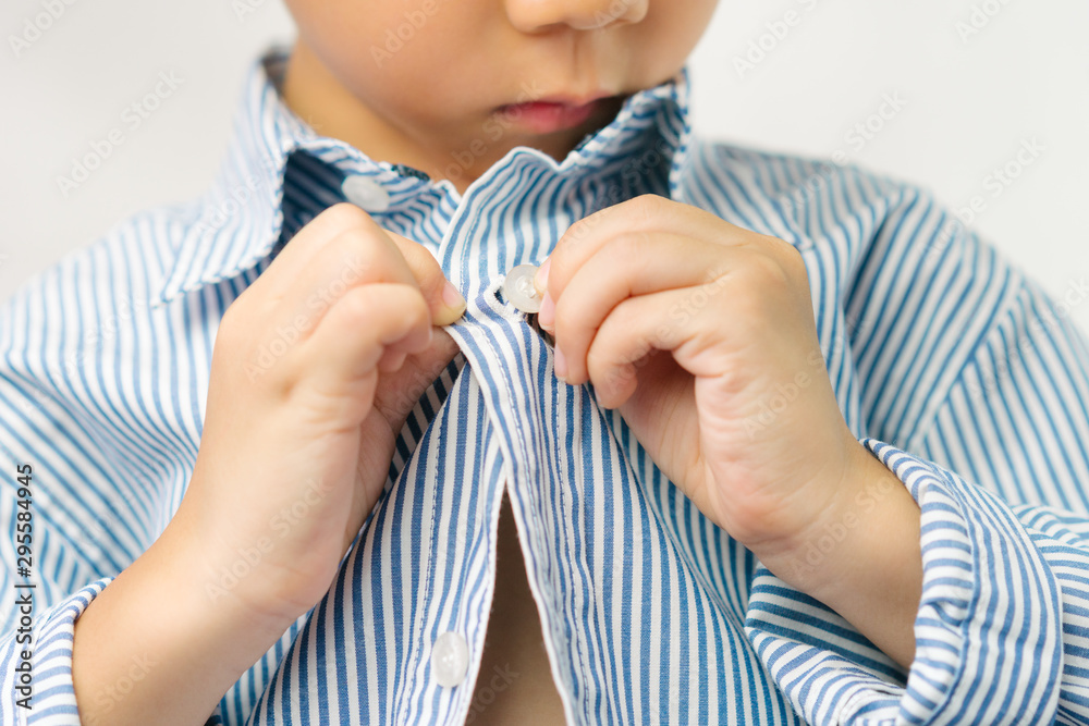 Child Development concept: Close up of a little kindergarten boy's ...