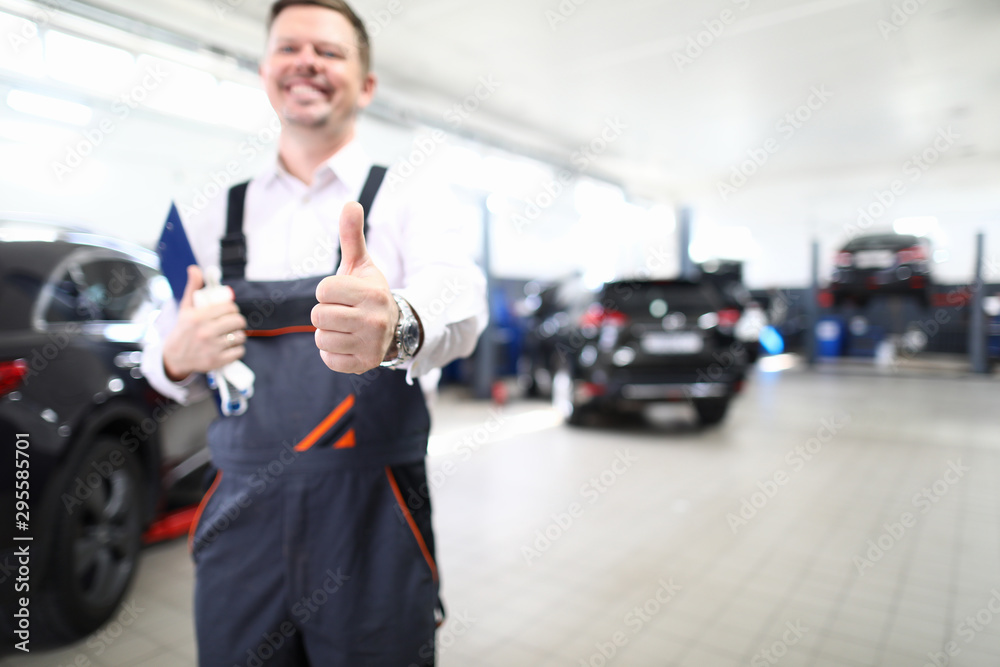 Focus on hand of happy engineer man showing thumb up and standing in ...