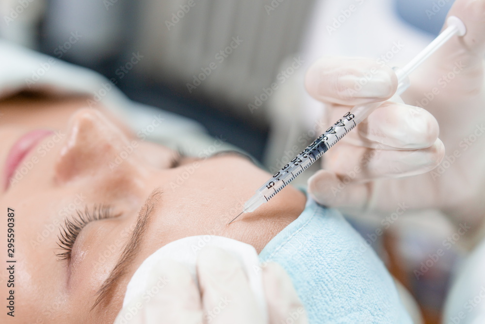 Beautiful girl at the reception of a dermatologist in the health clinic ...