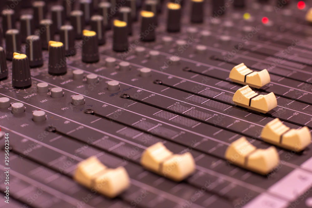 Slide the volume of the audio mixer on the console in the recording and ...