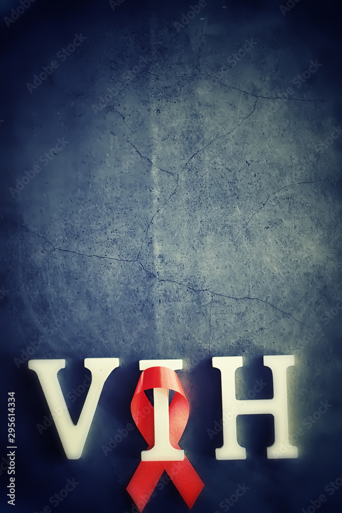 Symbol of human immunodeficiency virus disease. Red ribbon. A helping ...