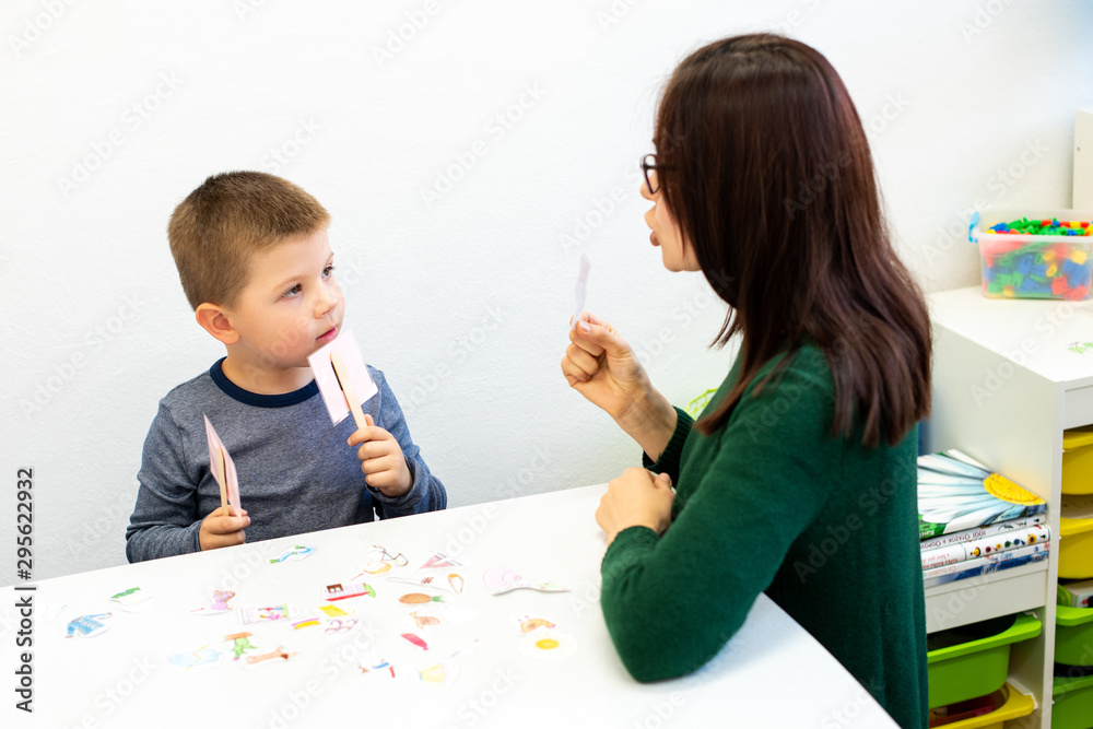 Children speech therapy concept. Preschooler practicing correct ...