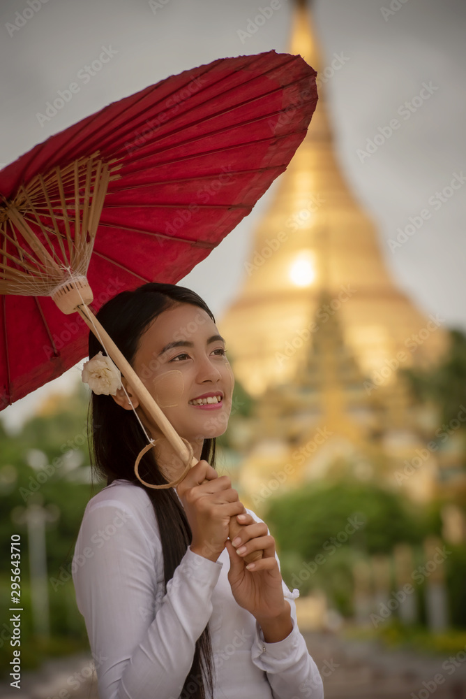Beautiful Burmese girls wearing national costumes Apply Tanaka powder ...