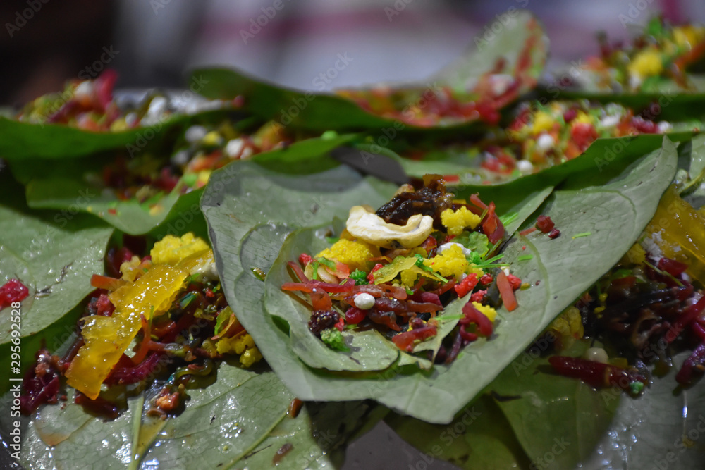Banarasi pan and meetha pan garnished with betel nut and other ...