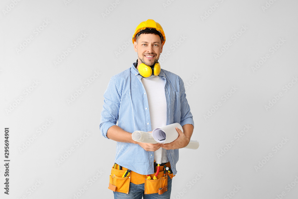 Portrait of male architect on light background Stock Photo | Adobe Stock