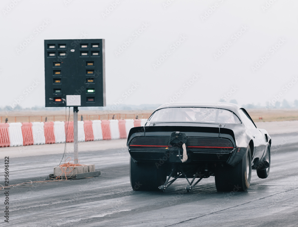 Dragster sets off on the racetrack. Dragster on the speedway. Drag ...
