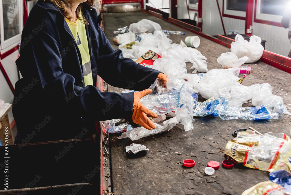 At modern recycling plant. Separate garbage collection. Workers sorting ...