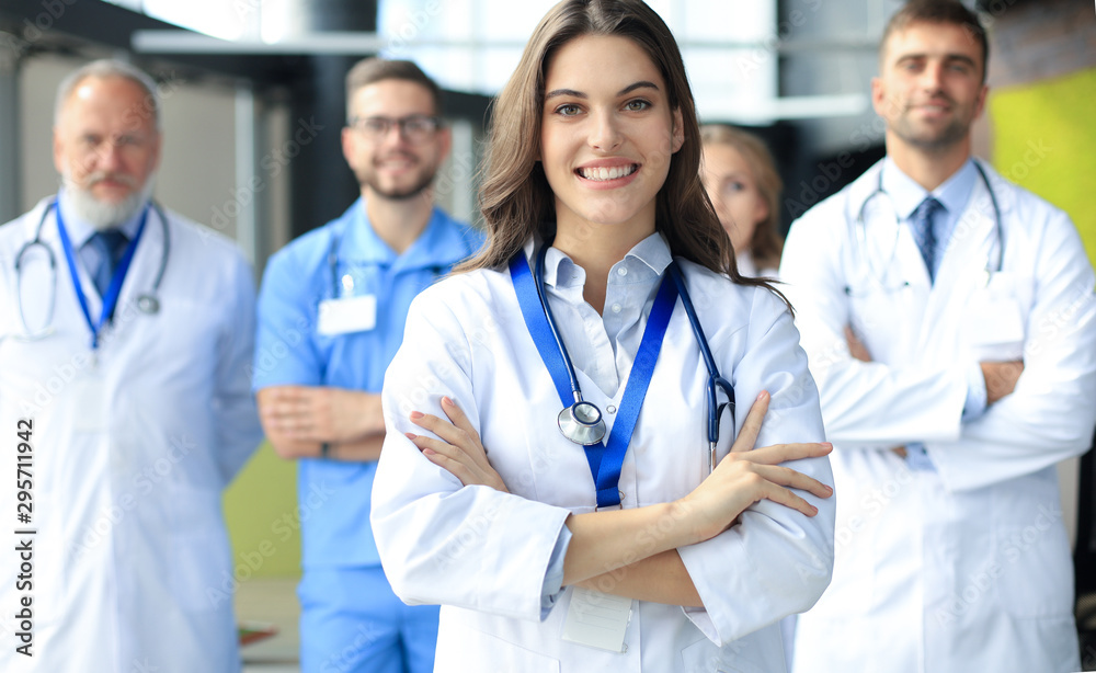 Female doctor with group of happy successful colleagues. Stock Photo ...