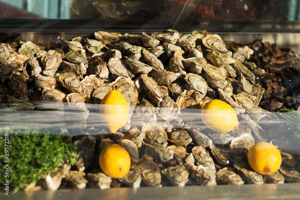 Behind the glass counter of the store on the window of a delicacy ...