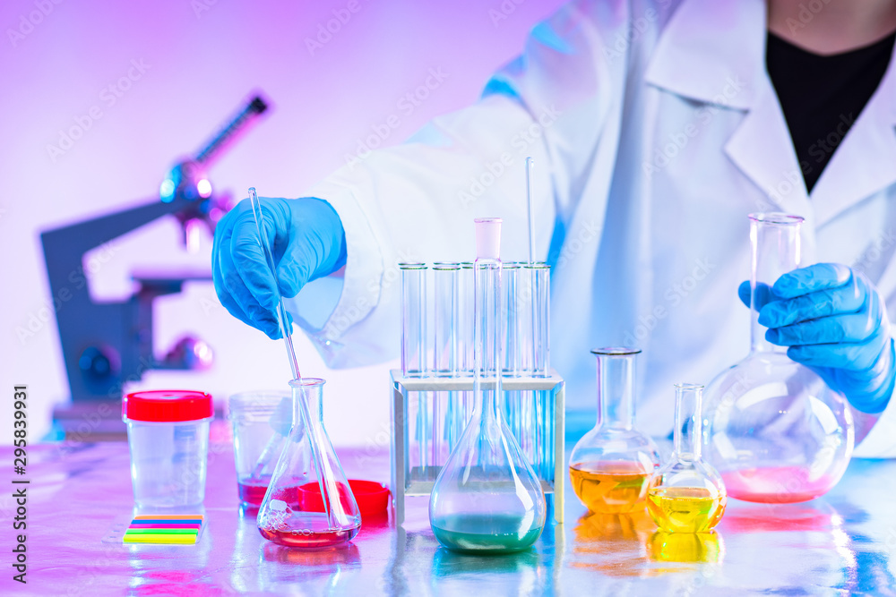 Chemistry. Mixing of chemical reagents. Chemist. A man works in a ...