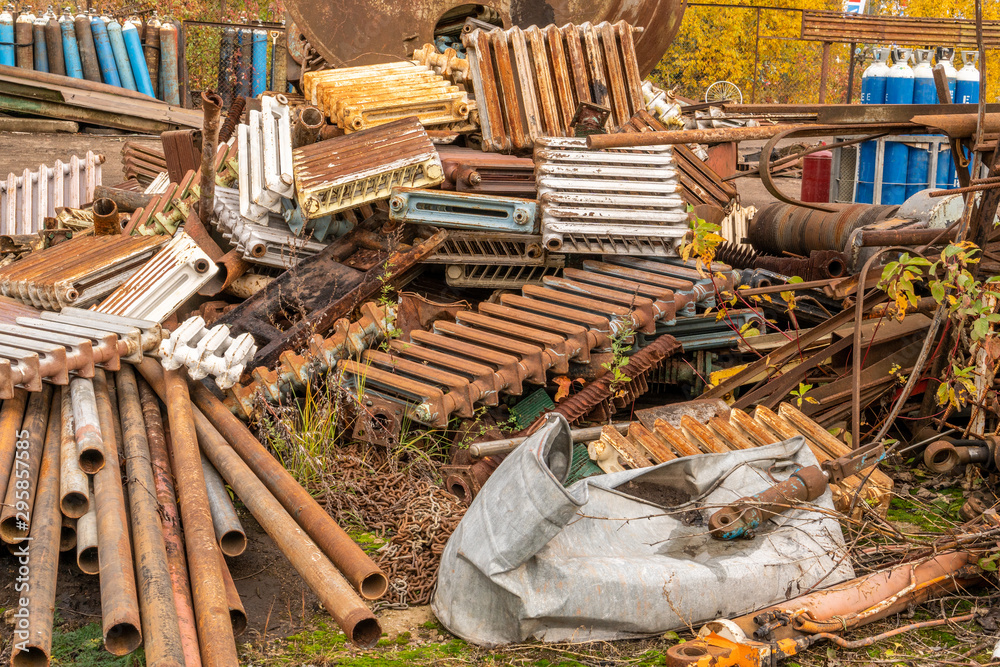 Scrap metal waste is stored in a recycling yard Stock Photo | Adobe Stock