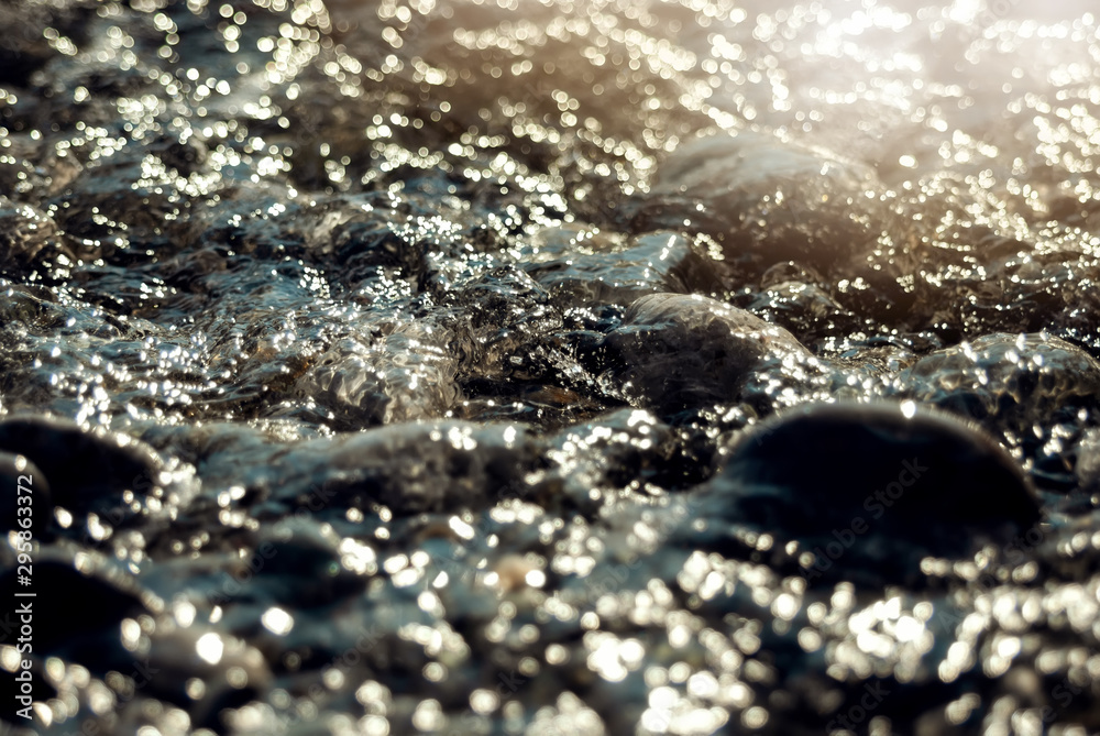 Water texture background. Sea water fast flow in the stones. Nature ...