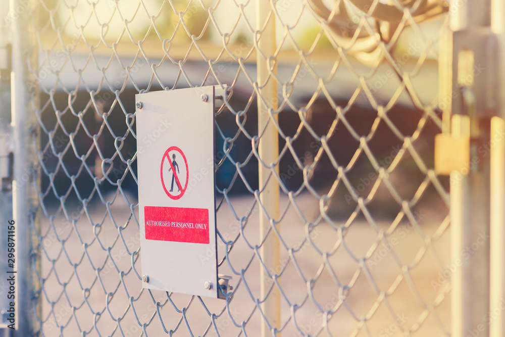 No Entry sign on mesh fence.Sign board says 'Authorised Personnel Only ...