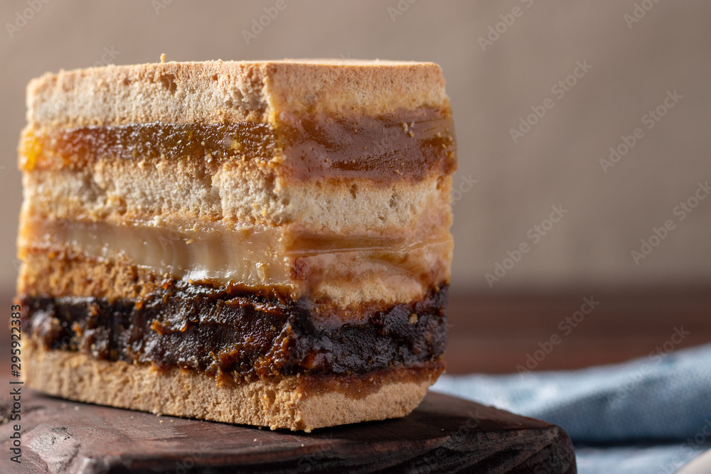 Delicious peruvian dessert called King Kong with dulce de leche and jam ...