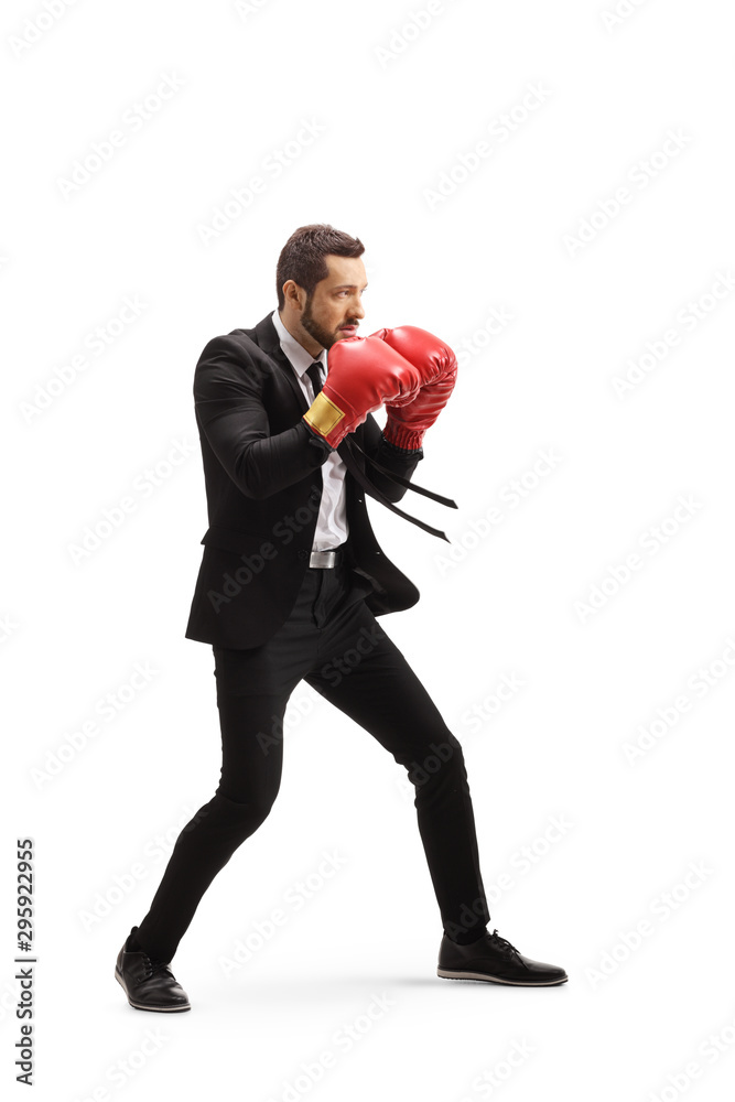 Man in a suit with boxing gloves in a guard position Stock Photo ...